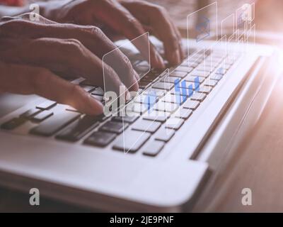 Hands man useing laptop computer with E-commerce technology icons on ...