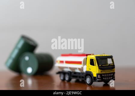 small toy combine with toy oil barrel Stock Photo - Alamy