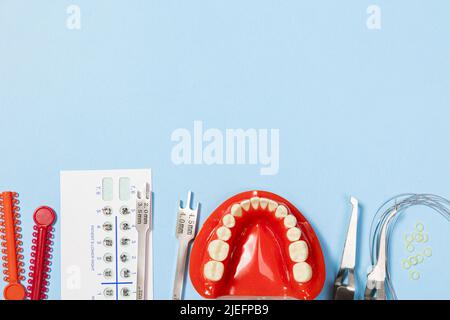 a set of special tools for an orthodontist to install braces for a ...