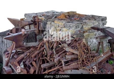 Medieval forge scenery including lots of scrap metal isolated in white ...
