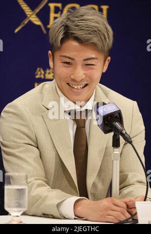 Japanese champion Naoya Inoue speaks during a press conference after ...
