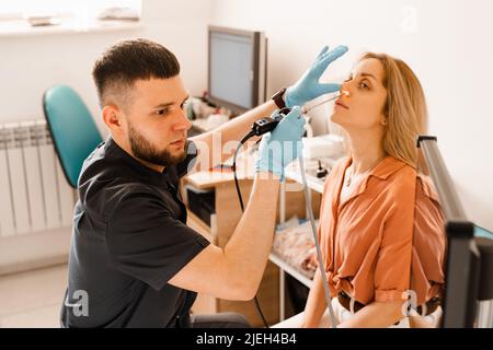 Nose endoscopy. Rhinoscopy procedure with rhinoscope. ENT doctor ...