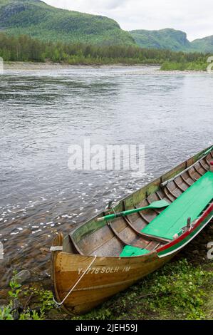 Wooden canoes to explore the Norwegian rivers Stock Photo - Alamy
