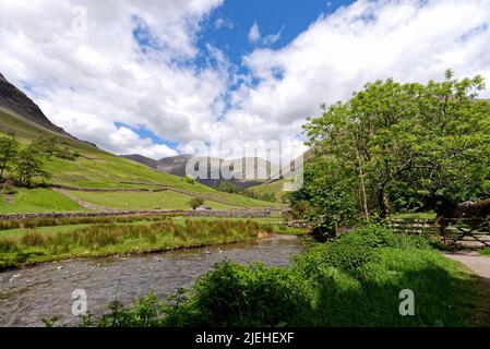 Mosedale Beck flowing through the rugged countryside at Wasdale Head on ...
