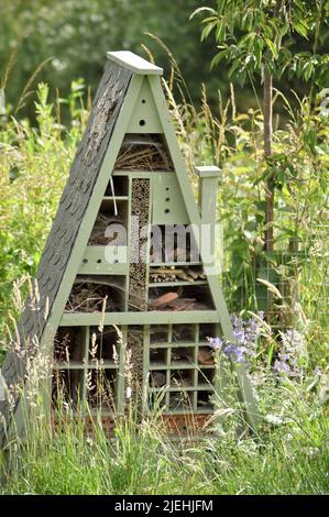 Triangular wooden bug hotel Stock Photo - Alamy