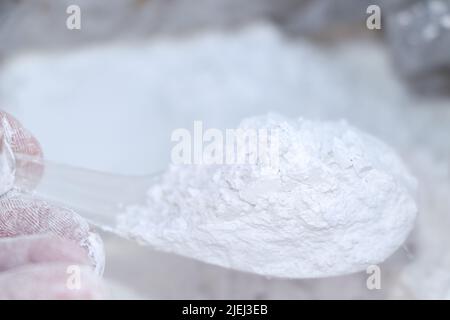 White calcium carbonate powder chemistry in factory Stock Photo - Alamy