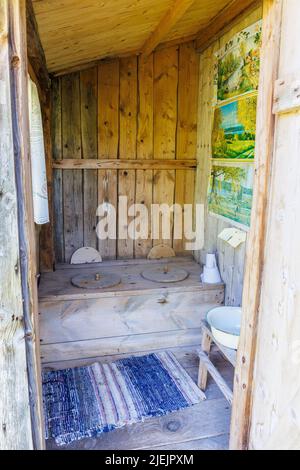 Old wooden double outhouse in the remote Russian village Stock Photo ...