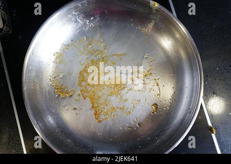 A Dirty Frying Pan top view Stock Photo - Alamy