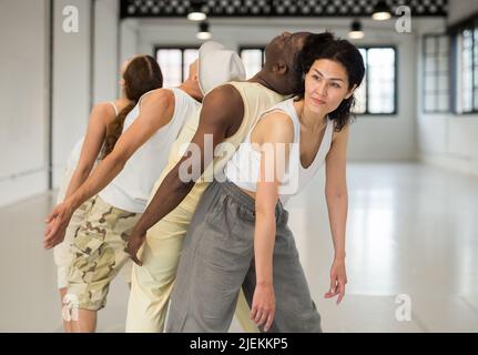 Group of artists demonstrating art performance Stock Photo - Alamy