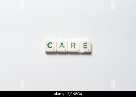 Care formed of scrabble blocks Stock Photo - Alamy