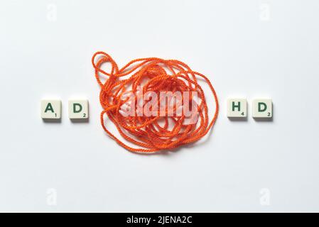 ADHD formed of scrabble blocks with tangled thread Stock Photo - Alamy
