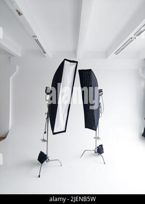 Lighting equipment and cyclorama in modern photo studio Stock Photo - Alamy