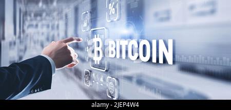Hand touching Bitcoin button. Modern business technology concept ...