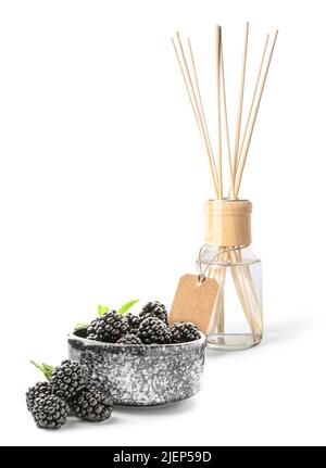Reed diffuser and blackberry on white background Stock Photo - Alamy