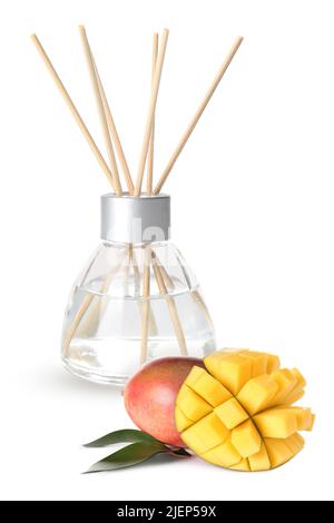 Reed diffuser and mango on white background Stock Photo - Alamy