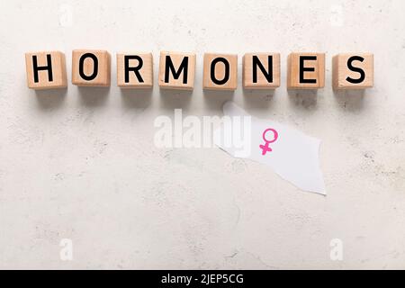 Female fertility symbol. Concept word Female fertility on wooden cubes ...