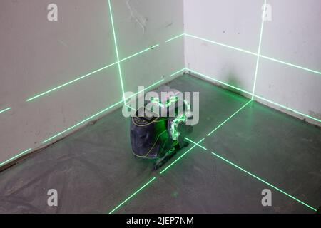 the laser level marks the lines for marking on the construction site ...