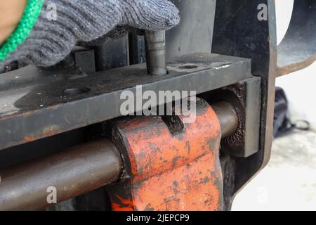 Lock fork of forklift before work Stock Photo - Alamy