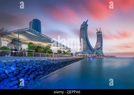 Katara buildings view from Lusail Marina Park. Crescent Tower Raffles ...