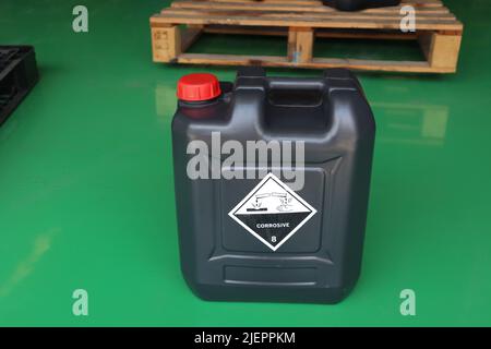 Corrosive chemical symbols on a black chemical tank Stock Photo - Alamy