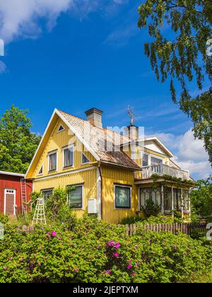 Yellow wooden cottage near Figeholm in Sweden Stock Photo - Alamy