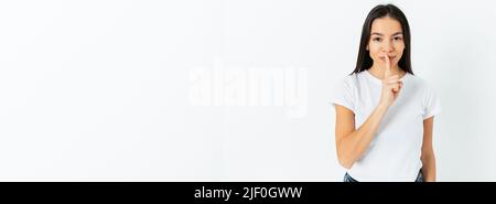 shh secret confidential woman serious shushing Stock Photo - Alamy