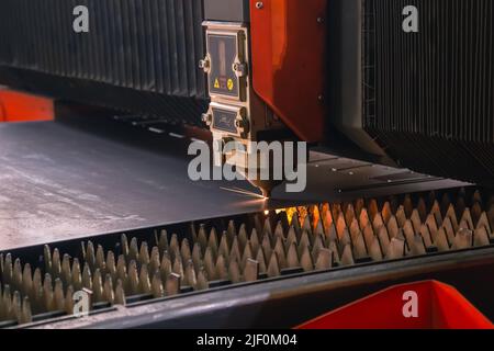 The laser machine is engaged in metal cutting at the factory Stock ...