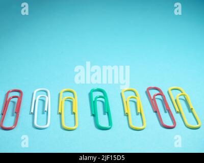 Paper work. Colored paper clips. Colored paper with staples. Work with ...