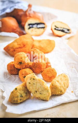 Finger food and street food - assortment of Arancini rice balls, fried ...