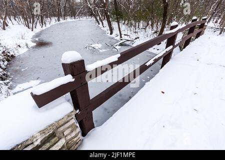 Rustic Bridge Over Frozen River In Winter Stock Photo - Alamy