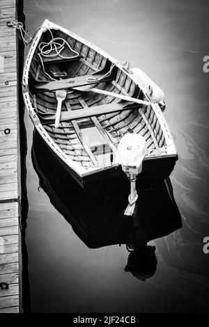 Traditional wooden rowboat with an old outboard motor Stock Photo - Alamy