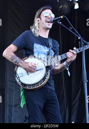 Banjo player Kyle Tuttle is shown performing on stage during a “live ...