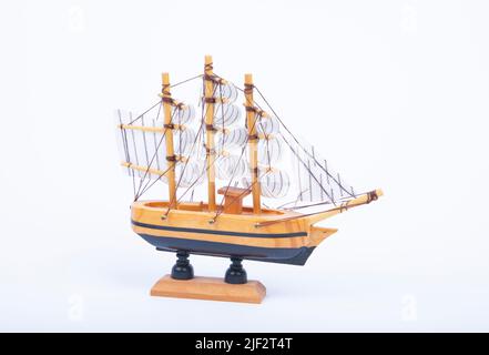 Beautiful small ship model isolated on white Stock Photo - Alamy