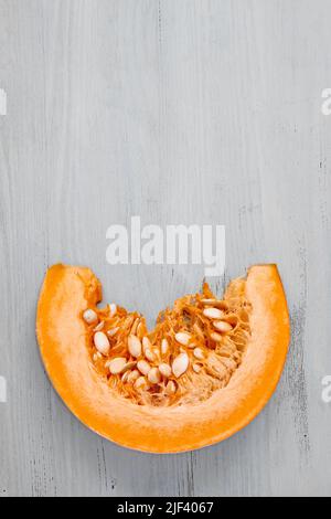Fresh organic pumpkin slice on dark wooden background Stock Photo - Alamy