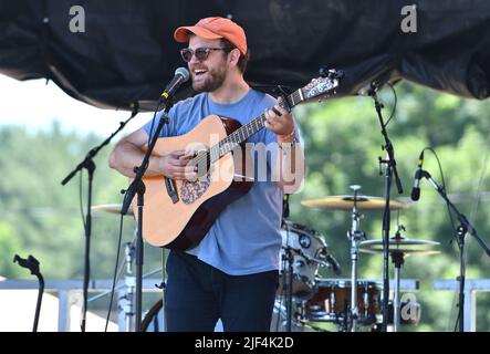 Musician Matthew Fowler is shown performing on stage during a “live ...