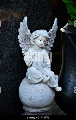 Little Grave Figurine on a Cemetery Stock Photo - Alamy