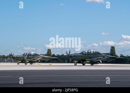 Christopher Cardona, Textron weapons loading technician, right, and ...