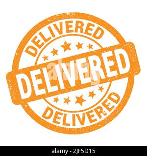 DELIVERED text written on orange grungy stamp sign Stock Photo - Alamy