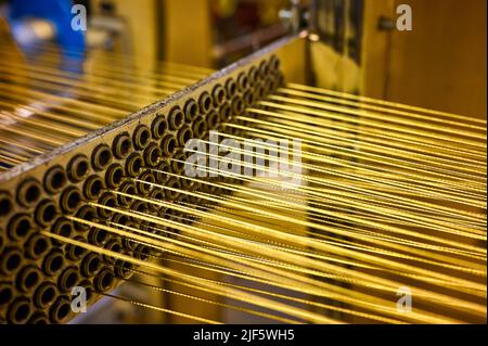 Bar with holes and strained wires in rolled steel workshop Stock Photo ...