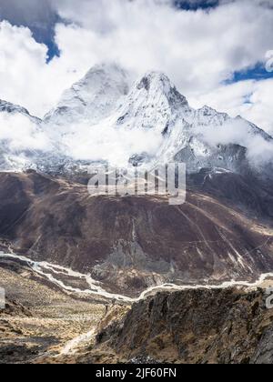 Ama Dablam shrouded in May clouds above the Imja Khola seen from ...