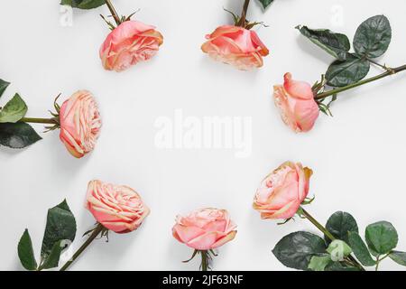 Round frame made of textile pink confetti in a heart shape. Monochrome ...