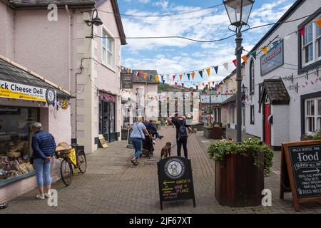 Visitors strolling through the shopping streets of the Lake District ...