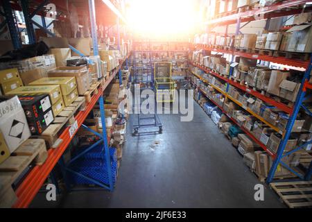 Goods and materials arranged on a rack in warehouse. Warehouse store ...
