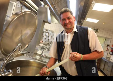 Schierke, Germany. 30th June, 2022. Brocken host Daniel Steinhoff stands on the Brocken in front ...
