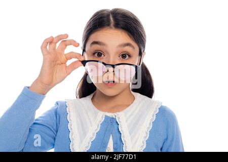Shocked preteen pupil holding eyeglasses isolated on white, banner ...