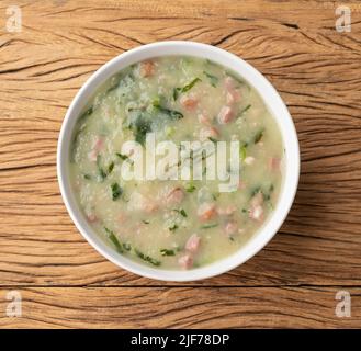 Cabbage soup in bowl over white stone background Stock Photo - Alamy