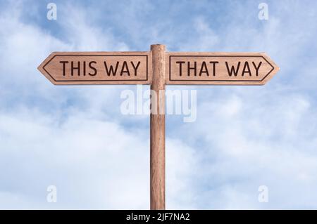 This way or That Way concept. Words in opposite directions on signpost ...