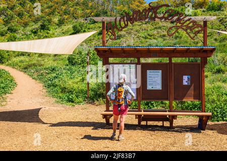 Interpretive signs and hiker at Harmon Canyon Preserve, Ventura ...