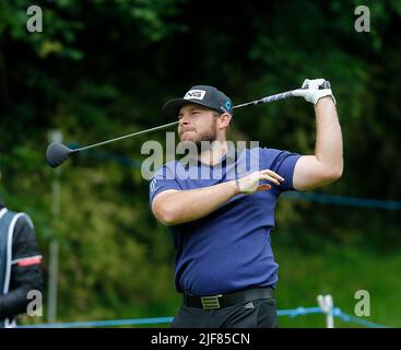 Tyrrell Hatton, of England, hits his tee shot on the 11th hole during ...