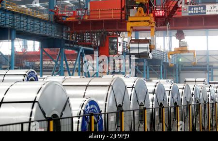 RIZHAO, CHINA - JUNE 30, 2022 - Steel coils are loaded at the workshop ...